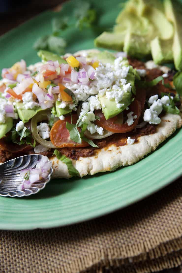Huaraches Topped with Chorizo Refried Beans, Tomatoes, and Avocados ...